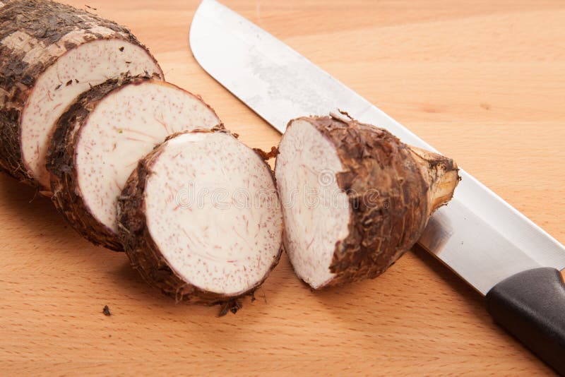 Cut taro on cutting board stock image. Image of knife - 52117637