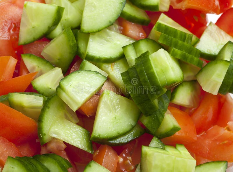 Cut tomatoes and cucumbers stock image. Image of tasty - 23266753