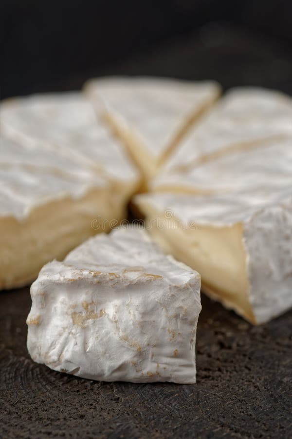 Cut Wheel of Brie Cheese on Wooden Surface Stock Photo - Image of ...