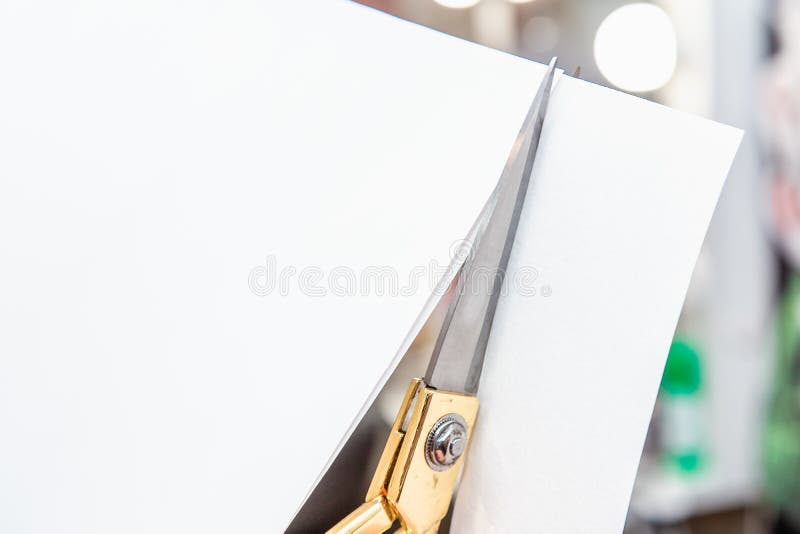 Cut White Paper with Gold Scissors in Close Up Stock Image - Image of ...