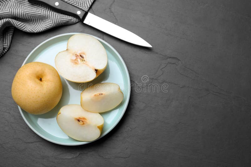 Cut and Whole Apple Pears in Bowl on Wooden Table Against Blurred ...
