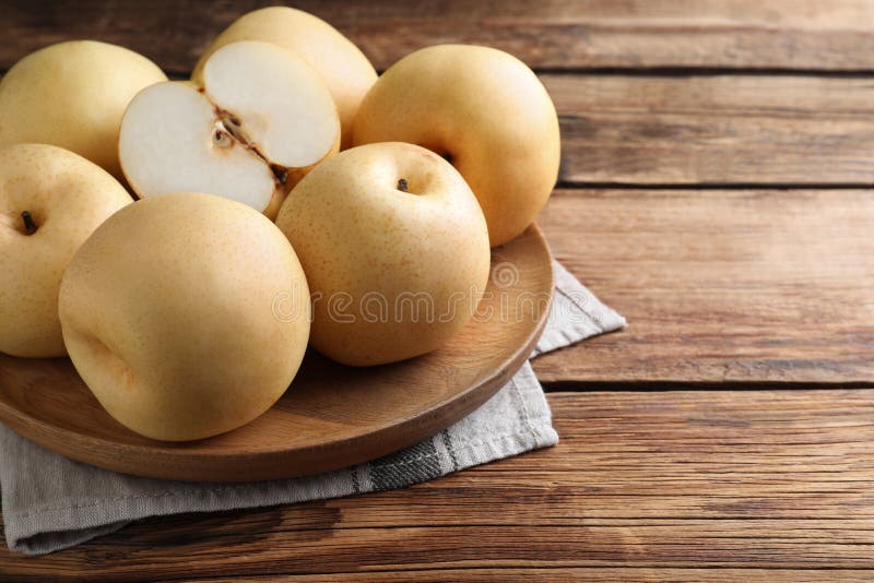 Cut and Whole Apple Pears on Wooden Table Stock Image - Image of ...