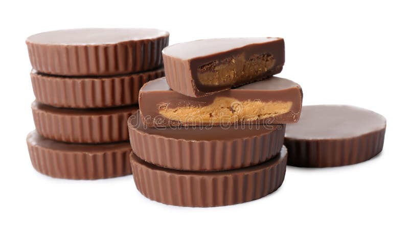 Cut and Whole Delicious Peanut Butter Cups on White Background Stock ...