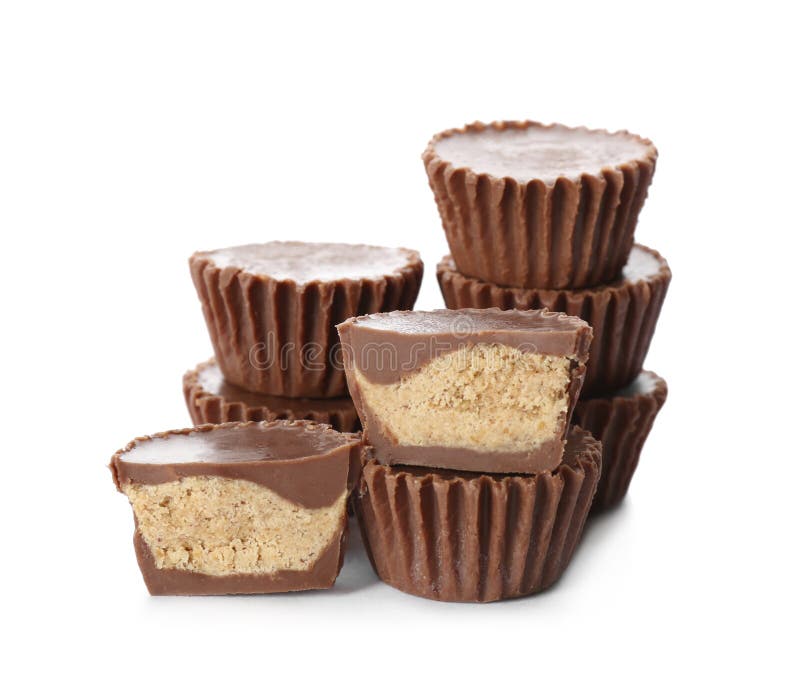 Cut and Whole Delicious Peanut Butter Cups on White Background Stock ...