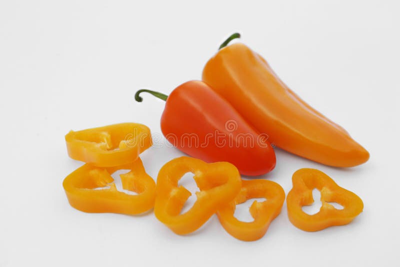 Cut and Whole Orange Hot Chili Peppers Isolated on White, Top View ...