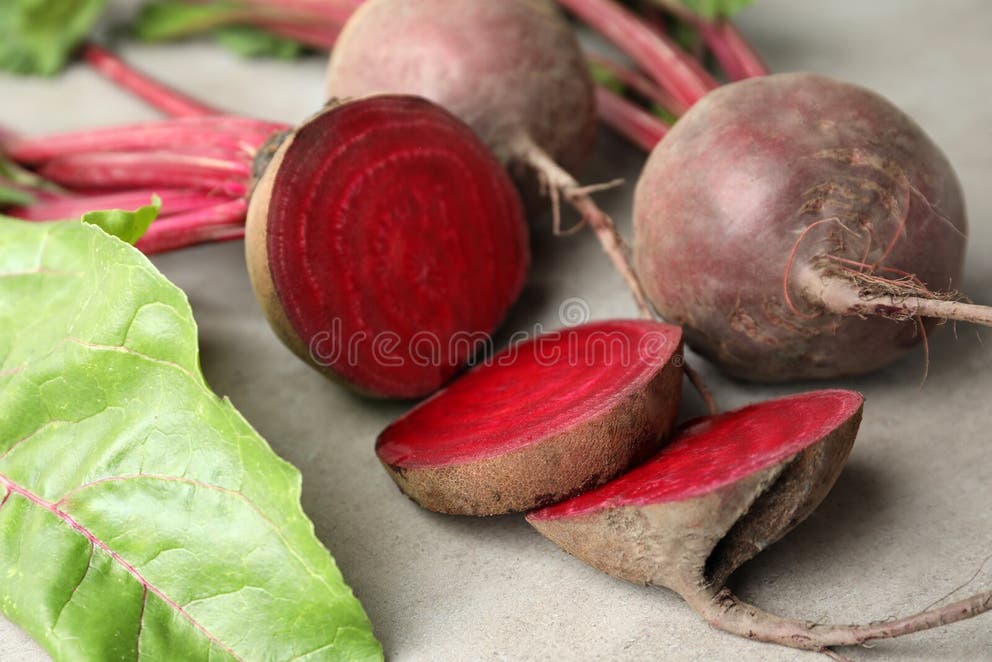 Cut and Whole Raw Beets on Grey Table, Closeup Stock Image - Image of ...