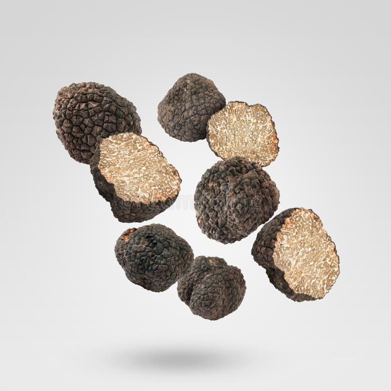 Cut and Whole Truffles Falling on White Background Stock Photo - Image ...