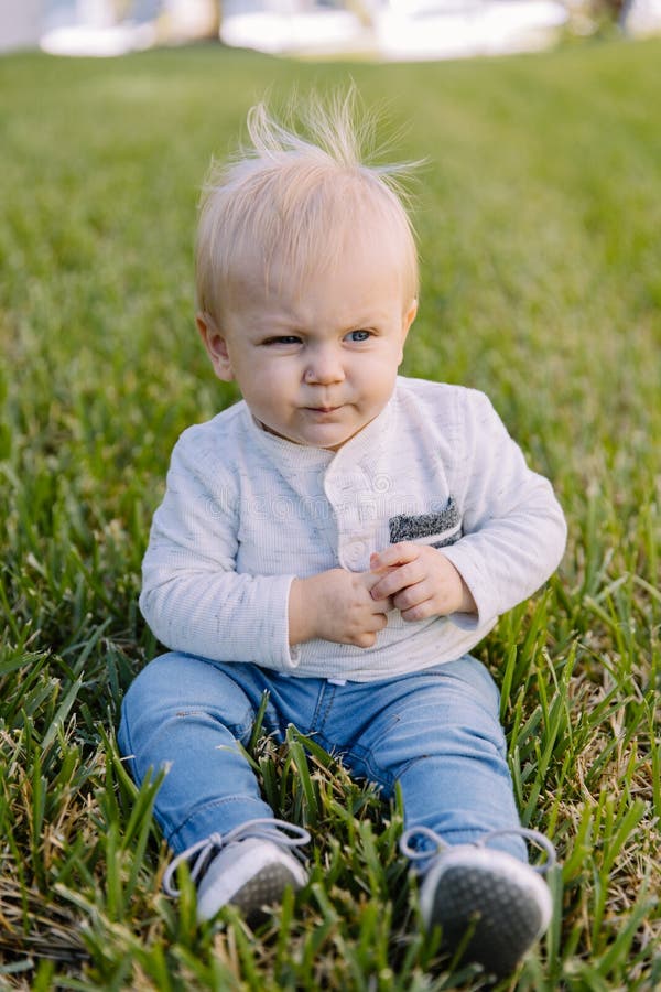 Cute and Adorable Young Toddler Baby Boy Playing in the Backyard Green ... Cute and Adorable Young Toddler Baby Boy Playing in the Backyard Green ...