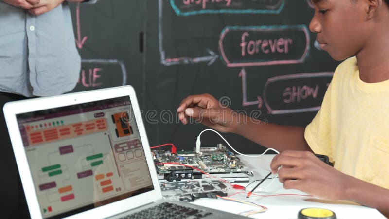 Cute Boy Learning To Use Electronic Tool while Laptop Display Code ...