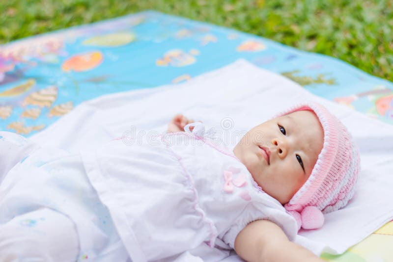 Cute Asian Baby Lie on Ground Stock Photo - Image of prone, child: 88677586