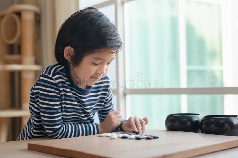 Asian Boy Learned To Play Chinese Go Game Stock Image - Image of ...