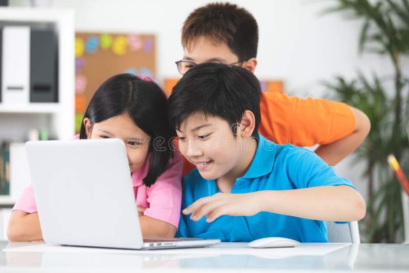 Cute Asian Children Using Laptop Together. Stock Image - Image of ...