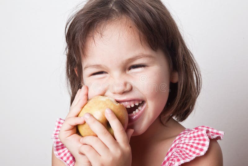 Cute Asian Girl Biting an Apple Stock Photo - Image of fred, nature ...