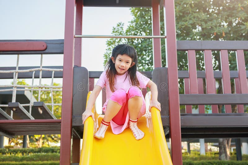 Asian Girl Playing on the Slide in the Playground Stock Image - Image ...