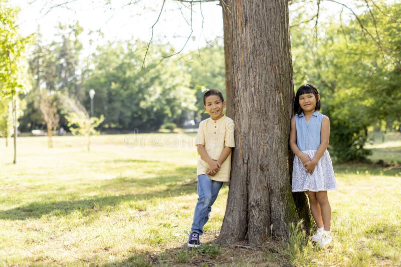 Asian Kids Posing by the Tree in the Park Stock Image - Image of ...
