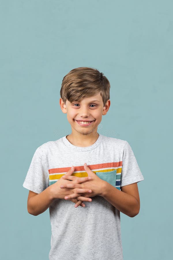 A Cute Autistic Elementary School Boy on a Mint Green Background with ...