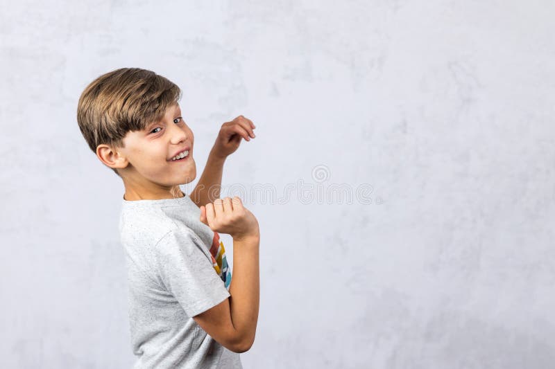 A Cute Autistic Elementary School Boy on a White Background with Copy ...