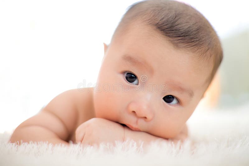 Chinese baby face smirking stock photo. Image of looking - 19376676