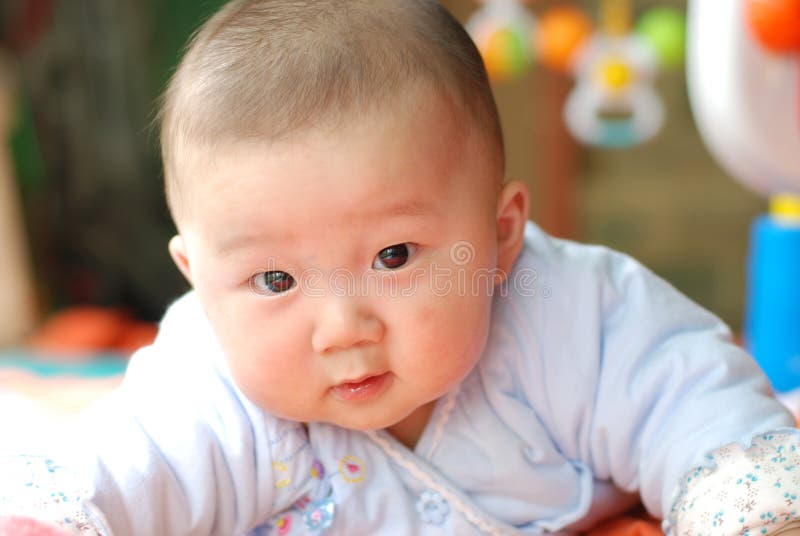 Chinese baby face smirking stock photo. Image of looking - 19376676