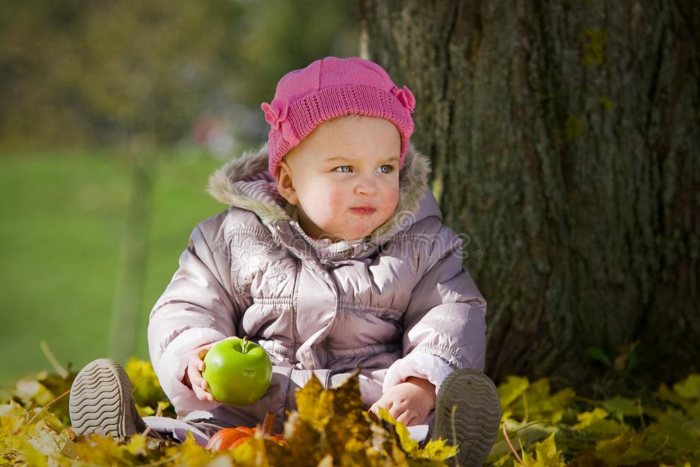 Cute baby with apple stock image. Image of park, smile - 16779225