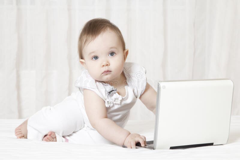 Small Baby and Laptop on Bed at Home #3 Stock Image - Image of ...