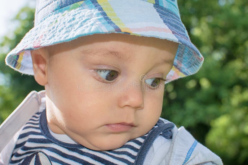 Cute baby boy with cap stock image. Image of outdoors - 93447261