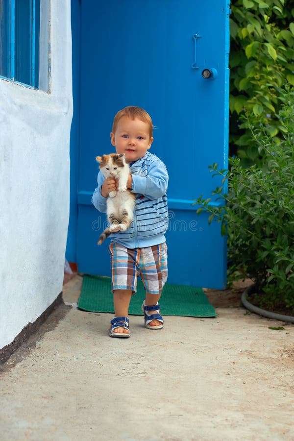 Boy Carrying Cat Stock Photos - Free & Royalty-Free Stock Photos from ...