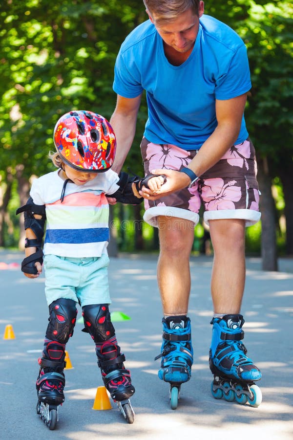 Cute Baby Boy and His Mom Learning Inline Skating Stock Photo - Image ...