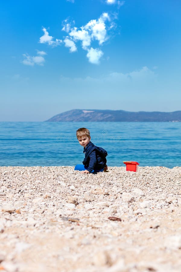 Cute Baby Boy Playing on the Beach with Water Stock Image - Image of ...