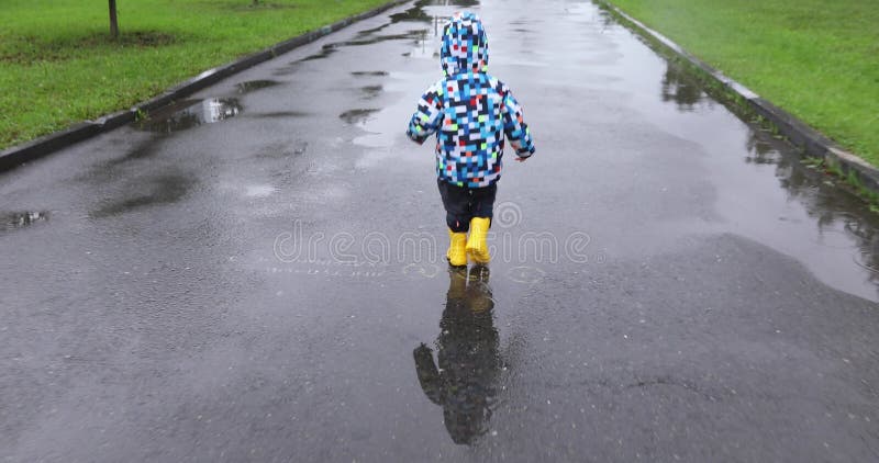 Cute Baby Boy is Runing in Puddle Stock Video - Video of drops ...