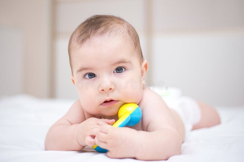 Cute Baby Boy is Playing with Rattle Stock Photo - Image of life ...