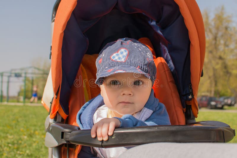 Cute Baby Boy in a Stroller Stock Photo - Image of head, childhood ...