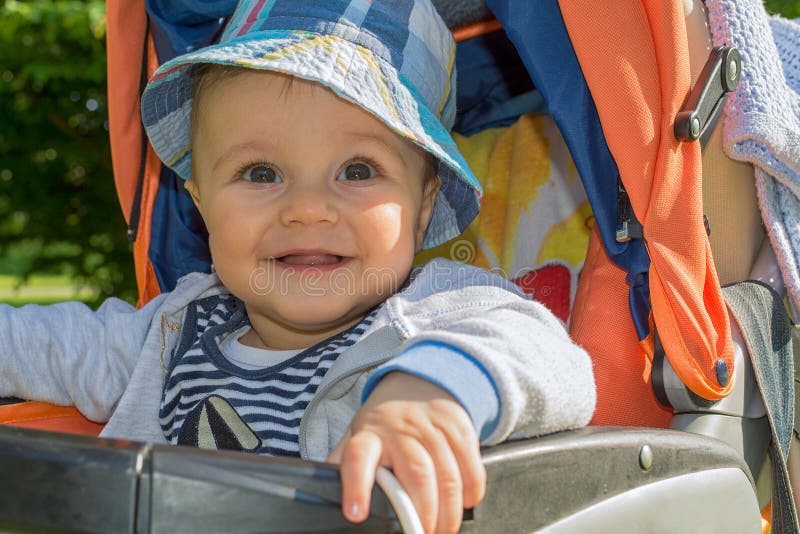 Cute Baby Boy in a Stroller Stock Photo - Image of jacket, months: 93447904