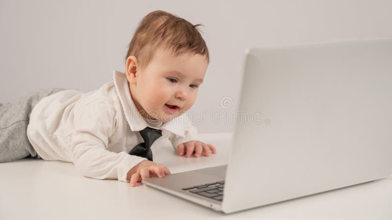 Cute Baby Boy in a Tie Working at a Laptop. Stock Image - Image of cute ...
