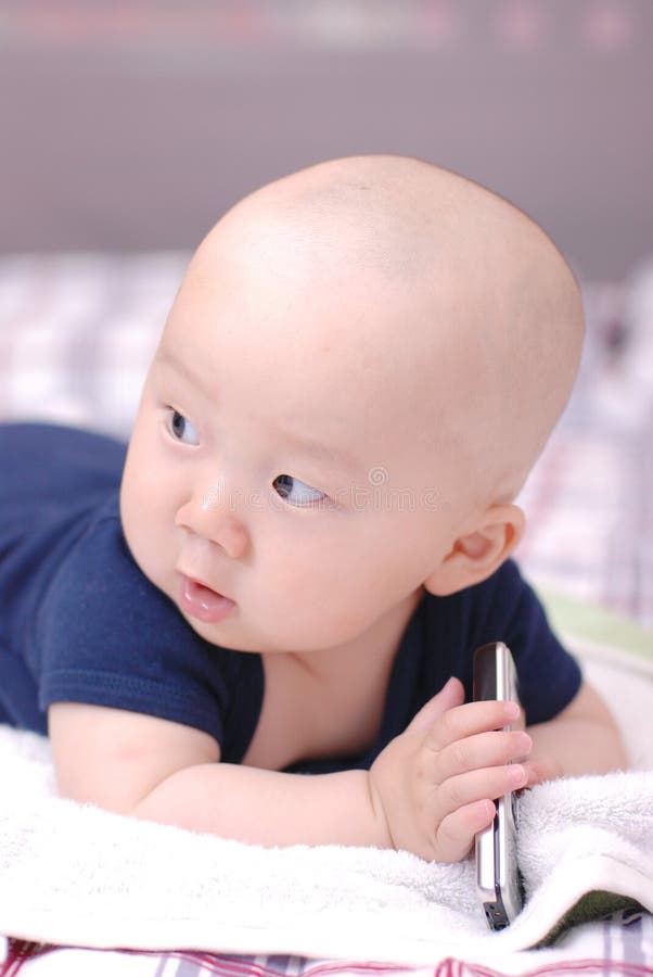 Cute baby with cellphone stock photo. Image of telephone - 10611638