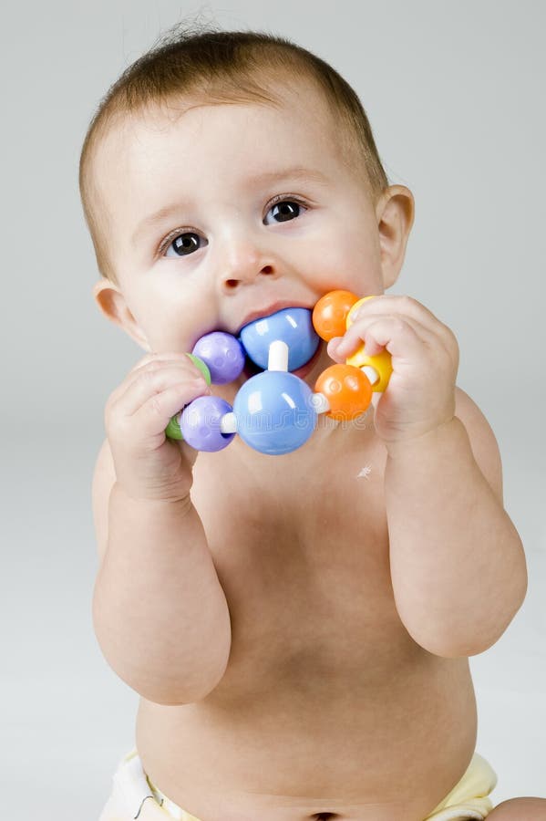 Cute Baby Chewing on Toy stock photo. Image of blue, infant - 16755472