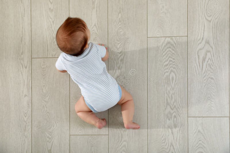 Cute Baby Crawling on Floor, Top View Stock Photo - Image of child ...