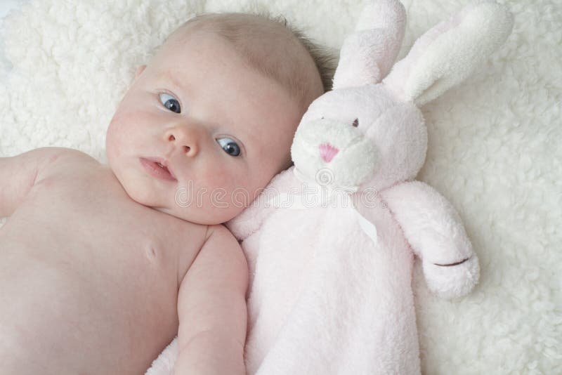 Cute Baby Cuddling with Pink Toy Bunny Blanket Stock Image - Image of ...