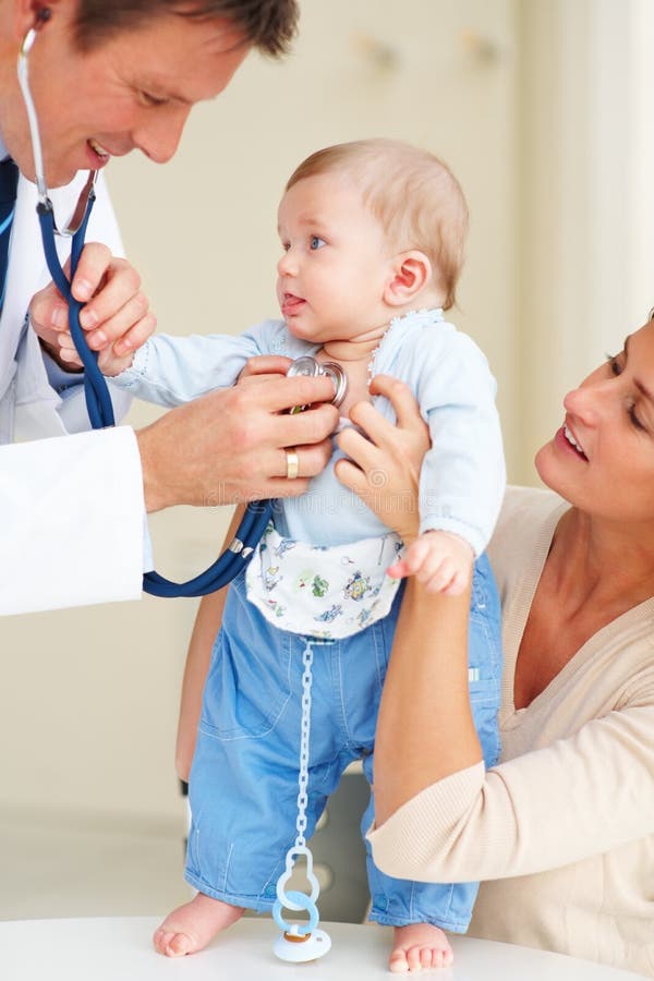 A cute baby and a doctor stock photo. Image of adult, mommy - 8379166