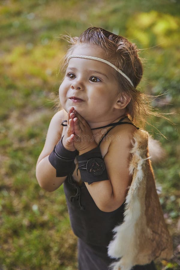 Cute Baby Dressed in the Clothes of Primitive People Stock Image ...