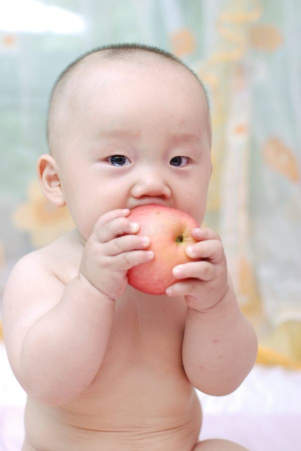 Cute baby eat apple stock image. Image of baby, infant - 10611727