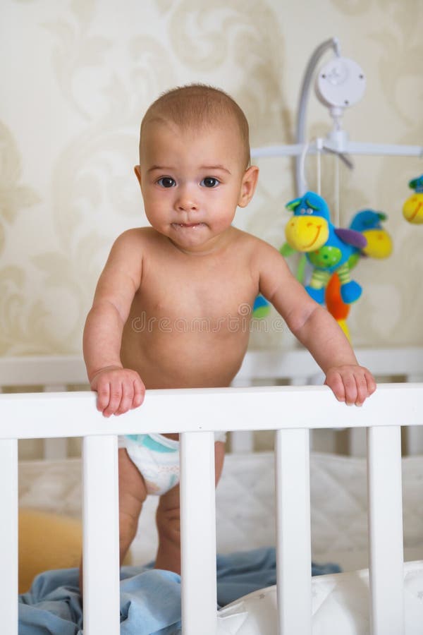 Cute Baby First Time Standing Up in His Cot Stock Image - Image of ...