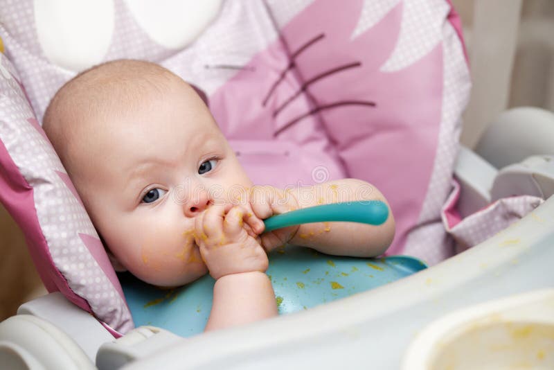 Baby Girl Eating with Spoon in Kitchen Stock Image - Image of meal ...