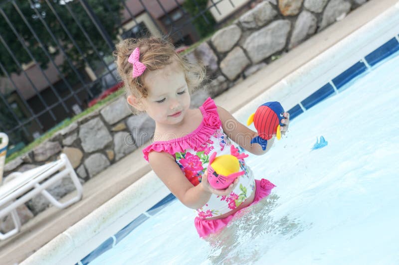 Cute Baby Girl is Having Fun in the Pool Stock Photo - Image of ...
