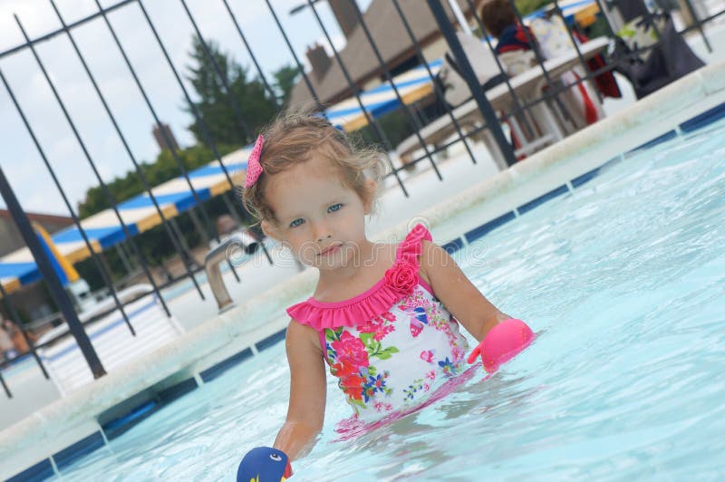 Cute Baby Girl is Having Fun in the Pool Stock Photo - Image of head ...