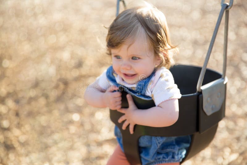 Cute Baby Girl Having Fun on a Swing Stock Photo - Image of cute, face ...