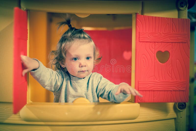Cute Baby Girl Head Out of Plastic Window Stock Image - Image of face ...