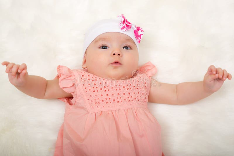 Cute baby girl lying stock image. Image of interior, cheerful - 79424347