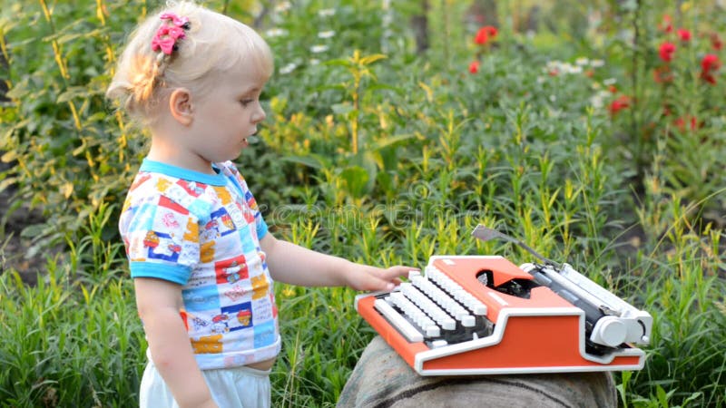 Cute Baby Girl Writing on a Vintage Typewriter Machine Stock Video ...