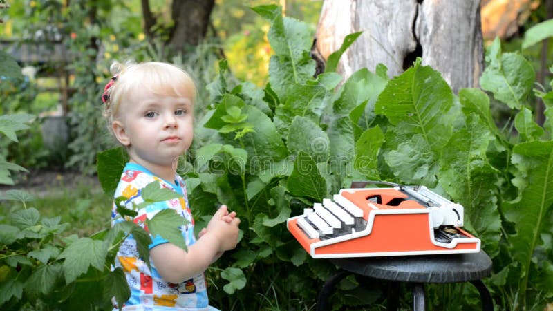 Cute Baby Girl Writing on a Vintage Typewriter Machine Stock Video ...